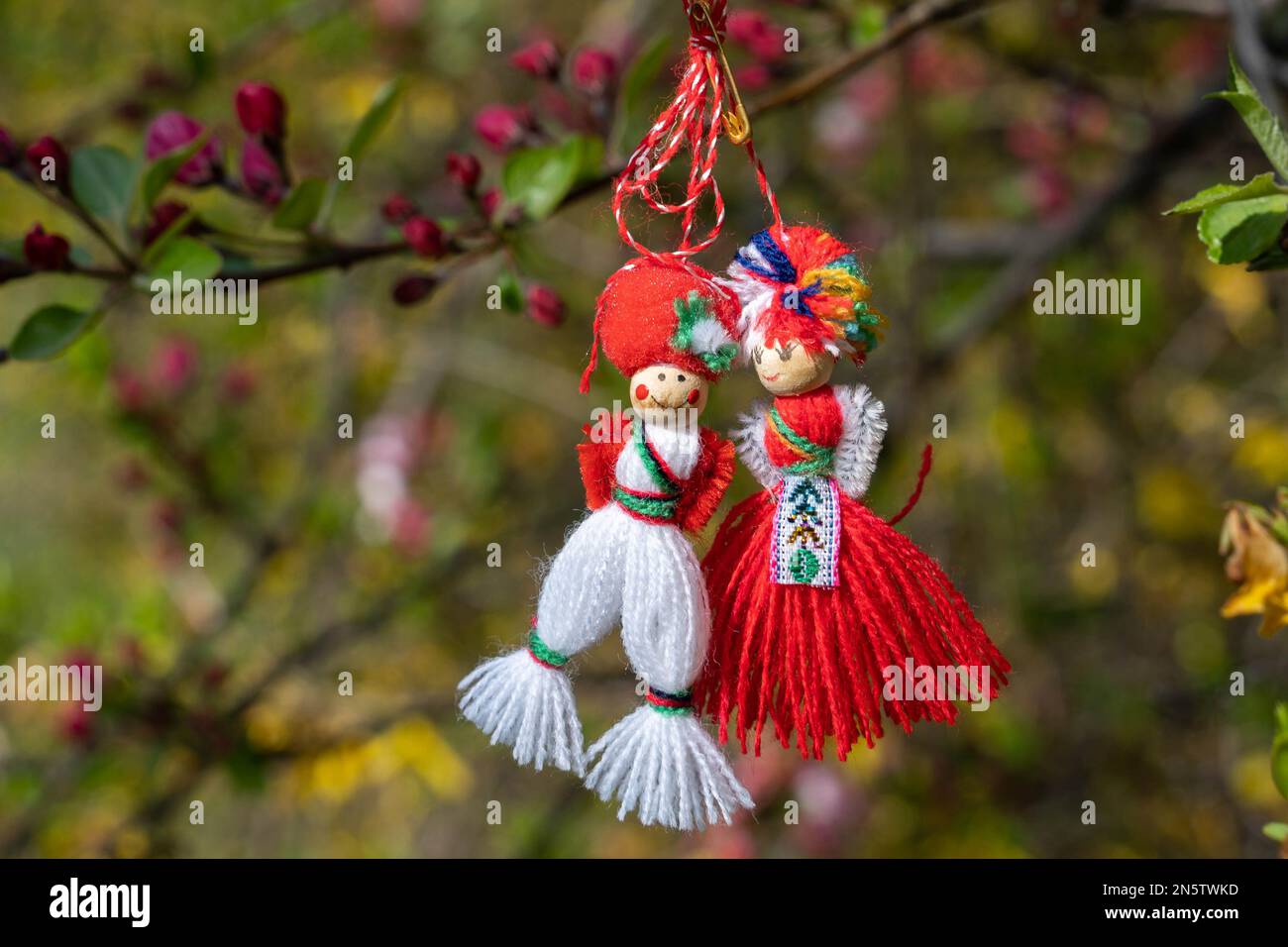 Greeting card background for the arrival of spring. Red-white man and ...