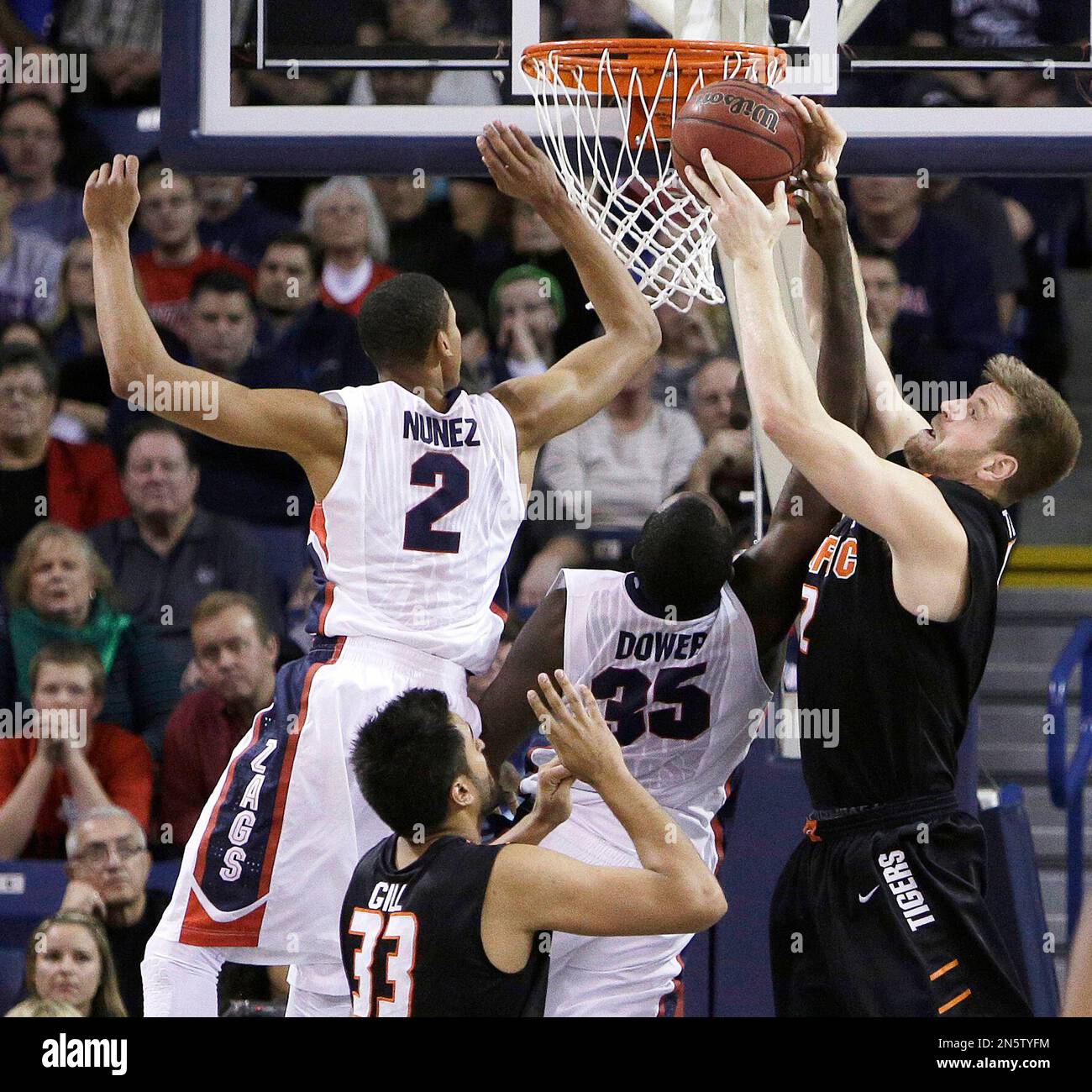 Pacific's Tim Thomas, right, grabs a rebound against Gonzaga’s Angel ...