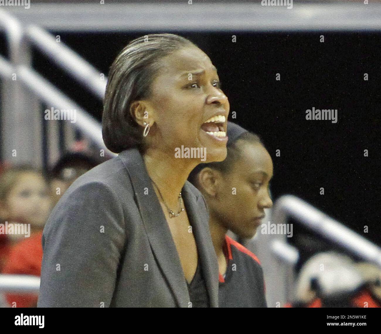 Cincinnati coach Jamelle Elliott shouts instructions to her team in a ...