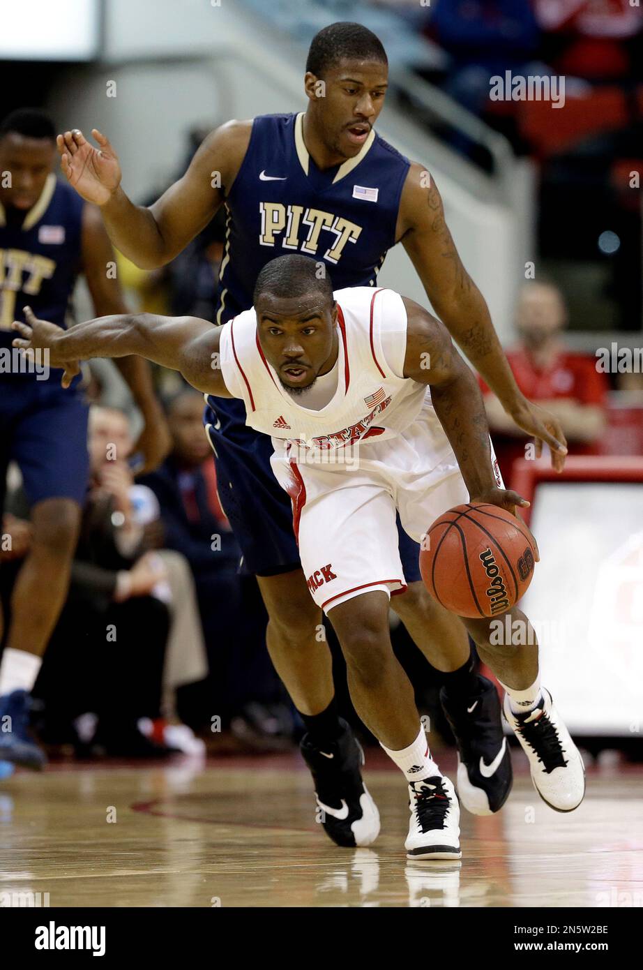 Pittsburgh's Lamar Patterson, rear, chases North Carolina State's ...