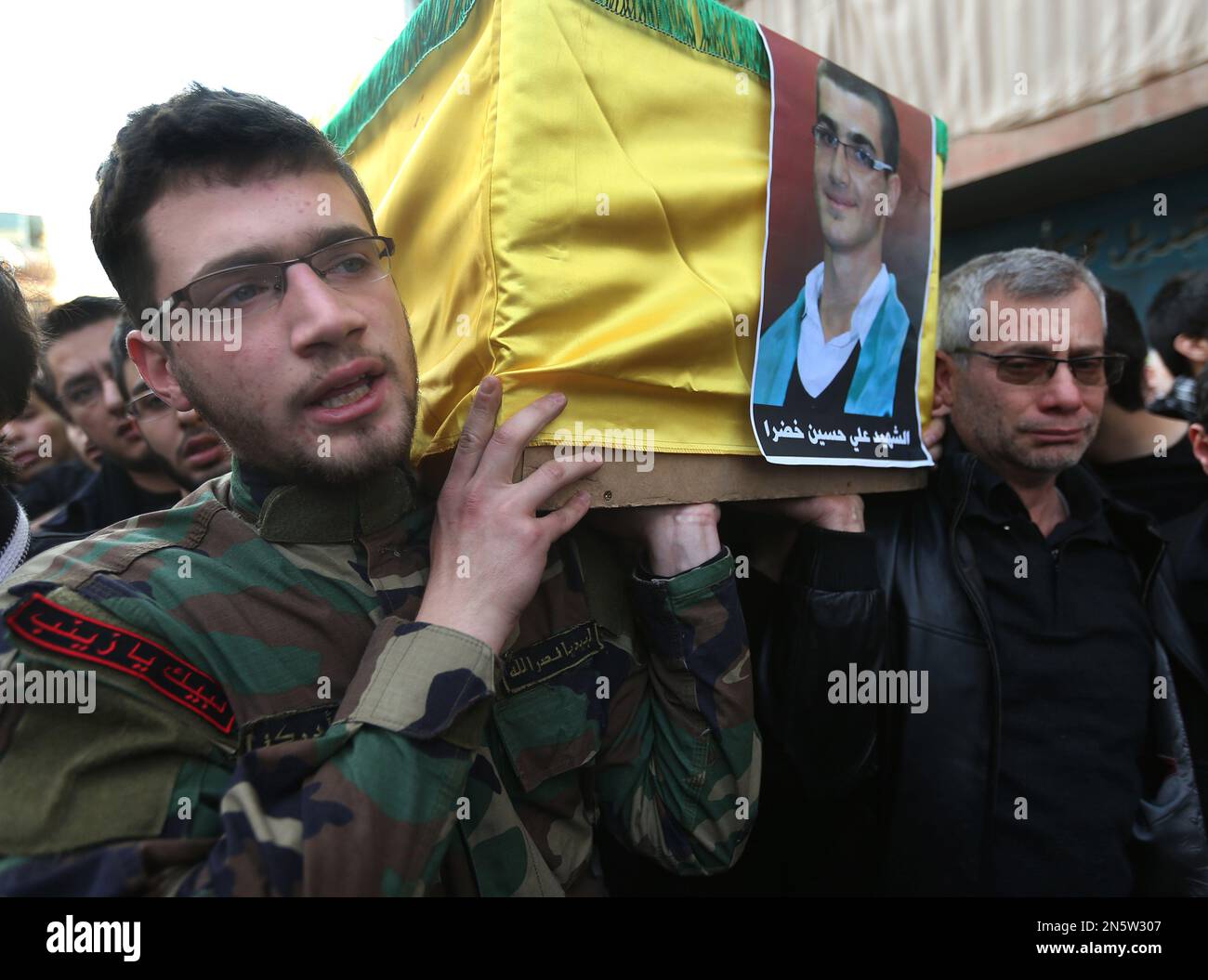 The father, right, and brother of Ali Khadra, left, who was killed ...
