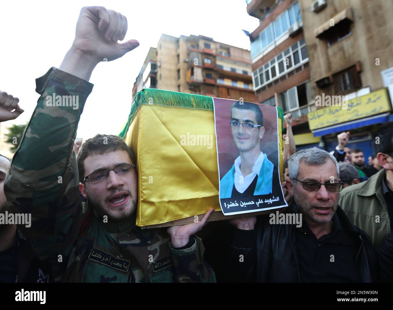 The father, right, and brother of Ali Khadra, left, who was killed ...