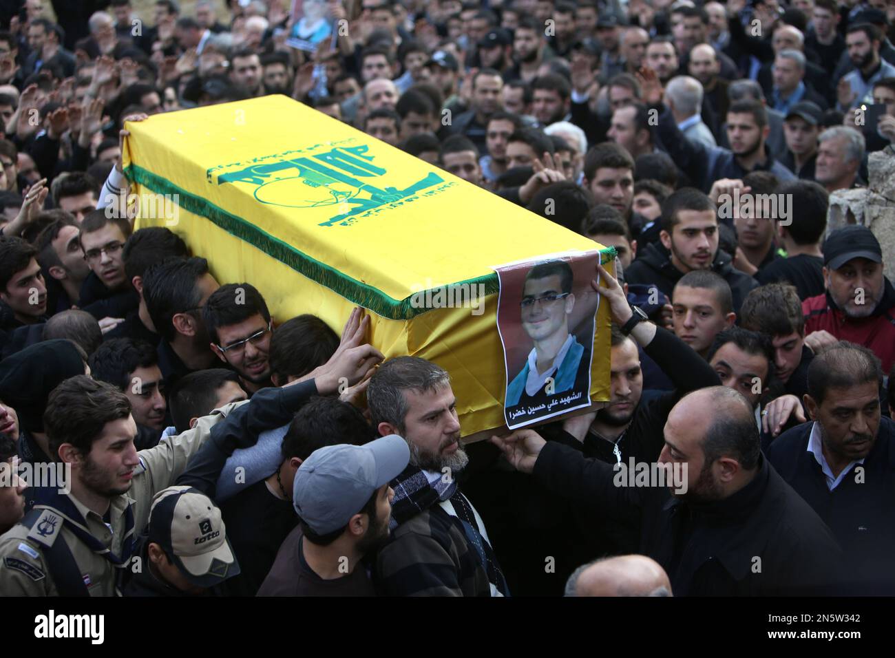 Mourners carry the coffin of Ali Khadra, who was killed Thursday by a ...