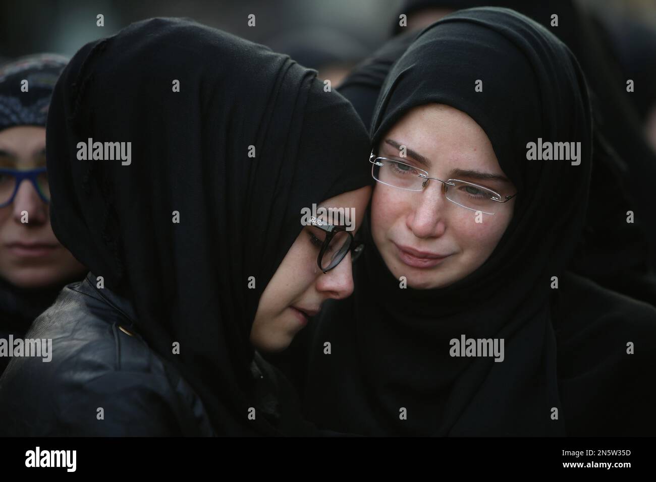 Sisters of Ali Khadra, who was killed Thursday by a bomb explosion ...