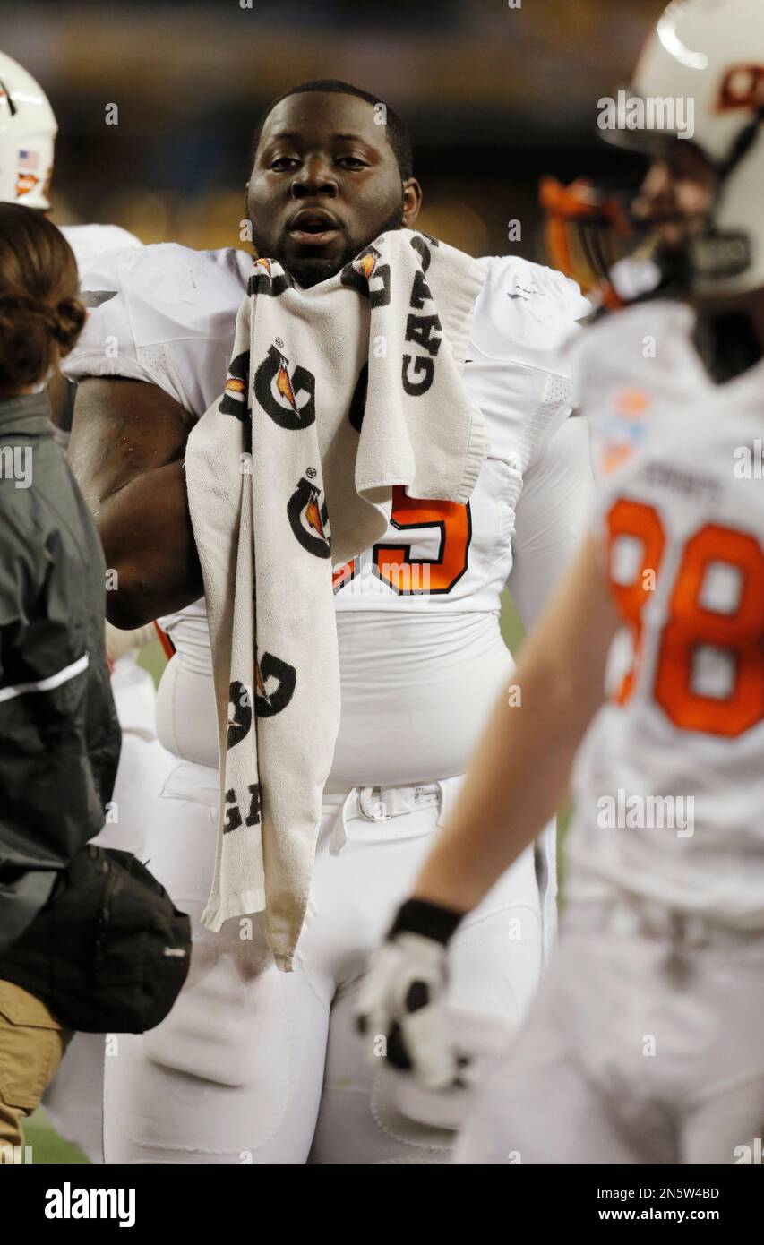 Oklahoma State defensive tackle Calvin Barnett (99) takes the field ...