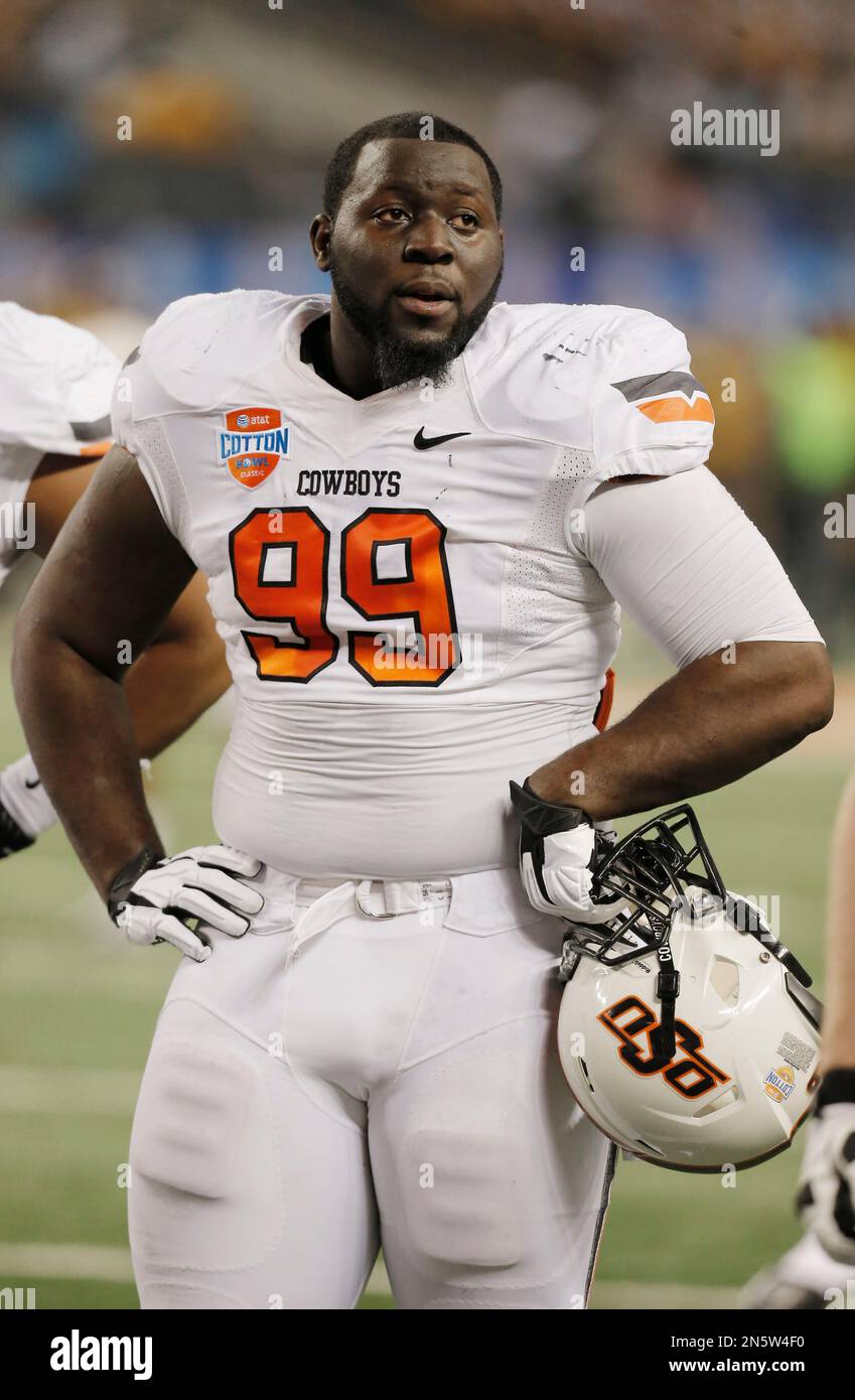 Oklahoma State defensive tackle Calvin Barnett (99) takes the field ...