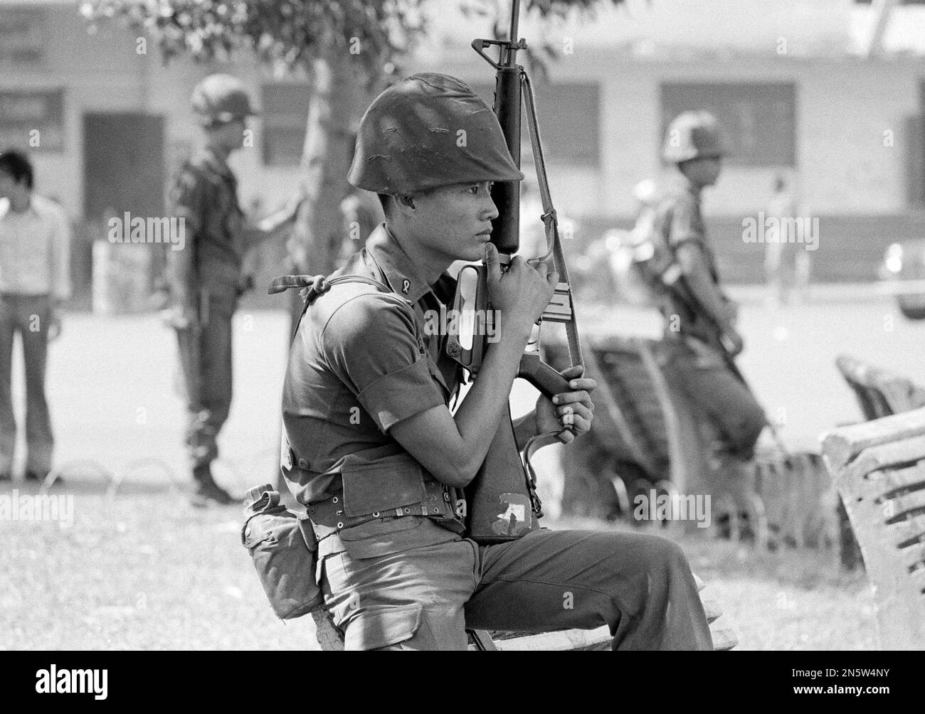 A Vietnamese military academy cadet guards his M16 rifle in Saigon's ...