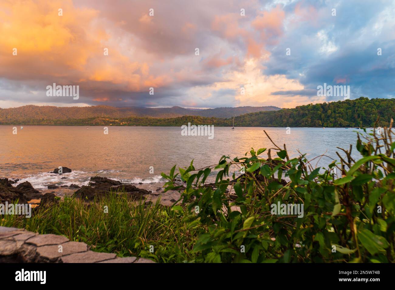 sun setting on Drake's Bay before a storm in Osa, Costa Rica Stock ...