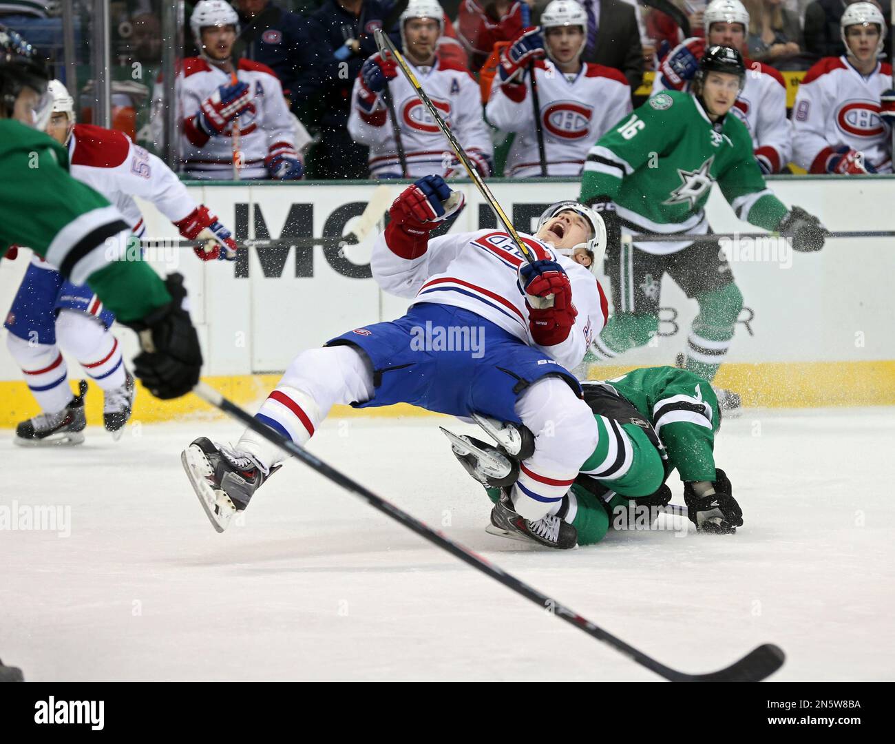 Montreal Canadiens right wing Brendan Gallagher (11) falls on Dallas ...