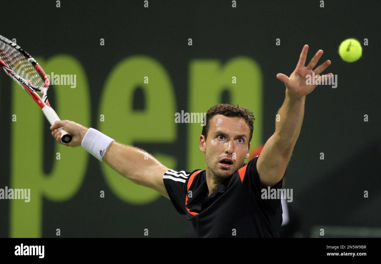 Ernests Gulbis of Latvi returns the ball to Spain's Rafael Nadal during ...