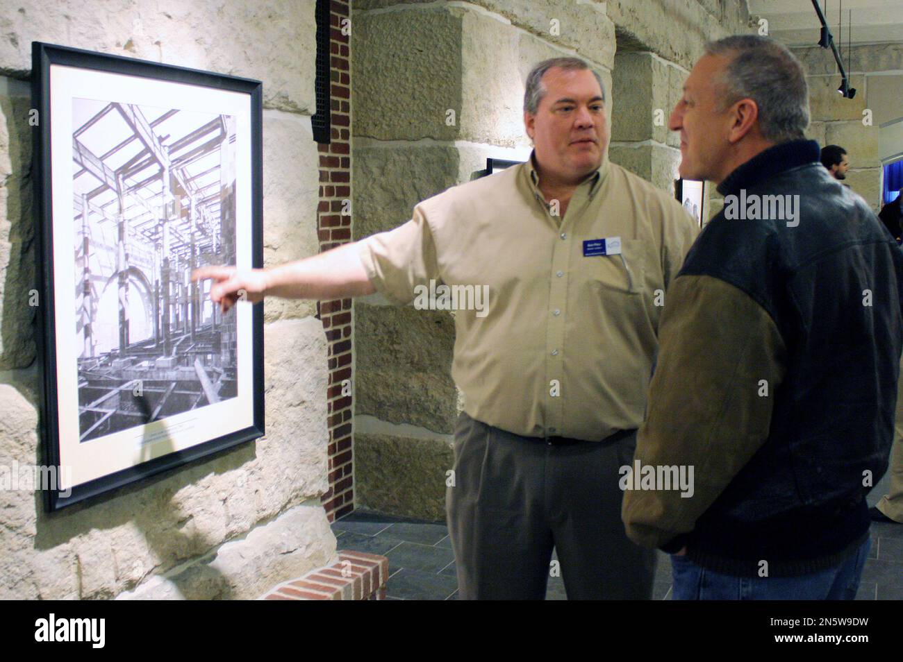 Ken Price, architect for the Kansas Historical Society, left, describes ...