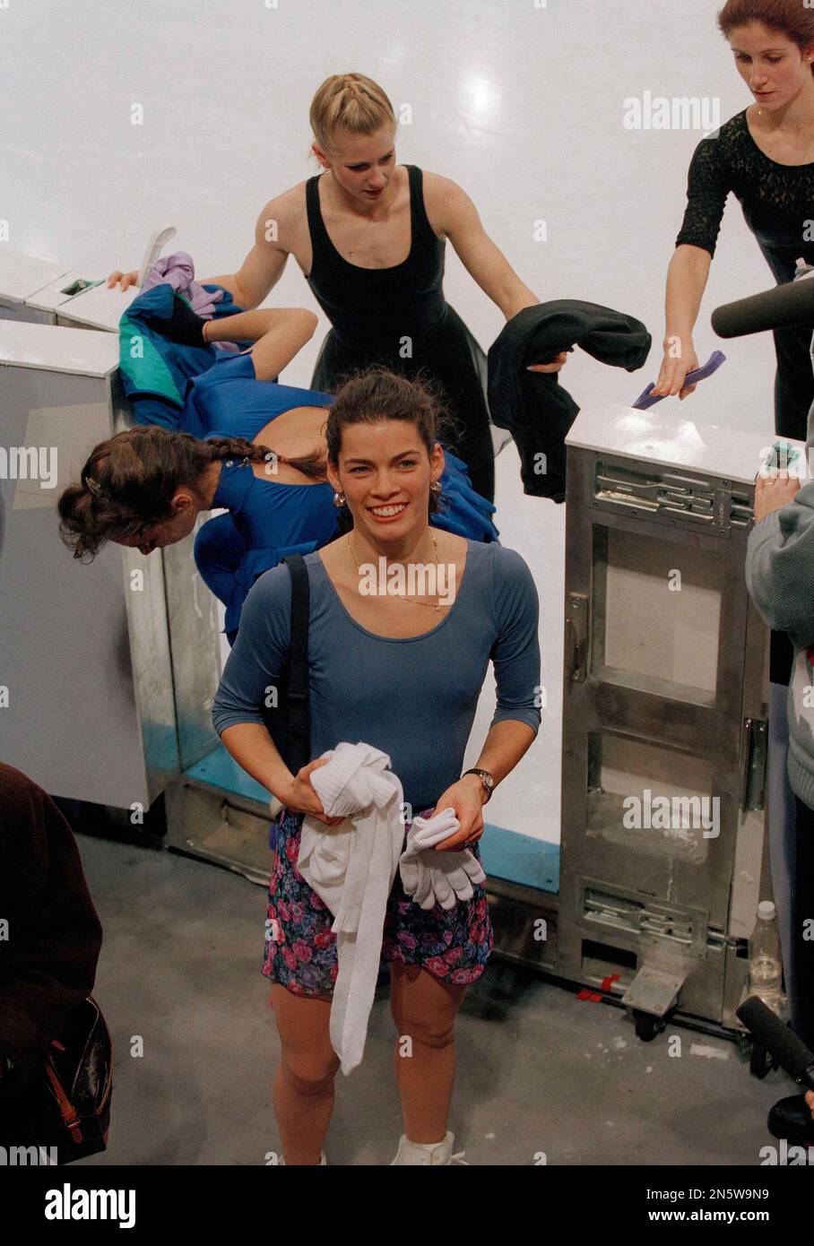 American figure skaters Nancy Kerrigan, front, and Tonya Harding exit ...