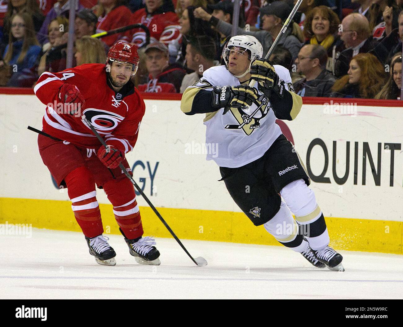 Pittsburgh Penguins' Sidney Crosby (87) eyes the puck with Carolina ...