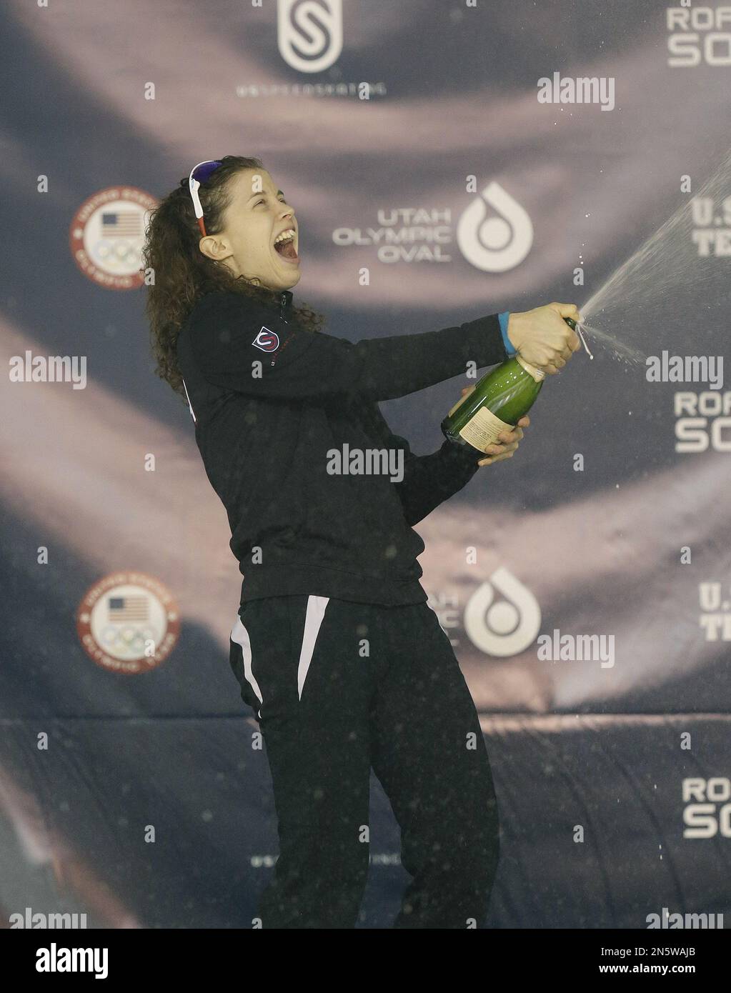 First place finisher Maria Lamb celebrates on the podium after the ...