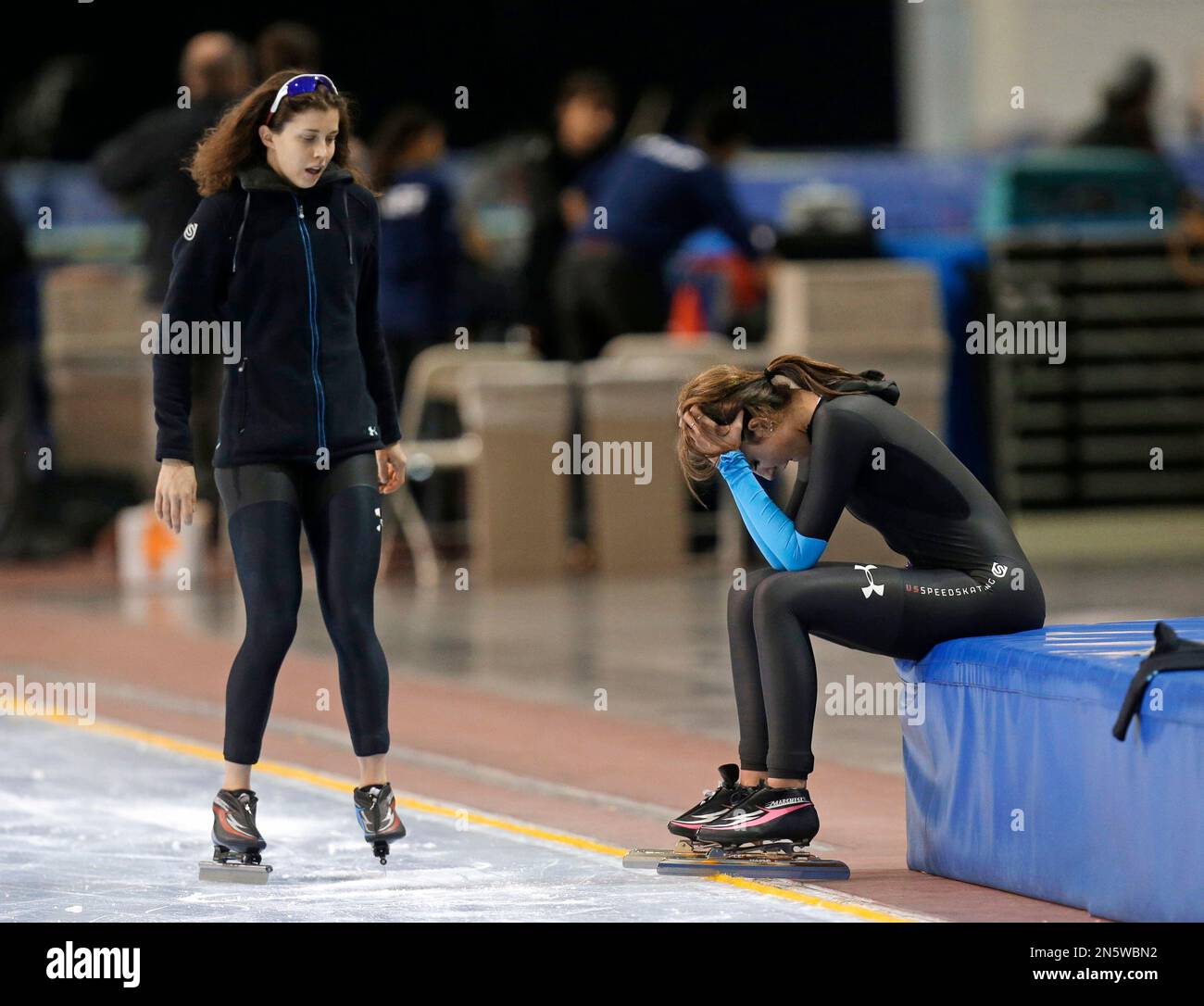 First-place finisher Maria Lamb, left, skates up to Petra Acker after ...