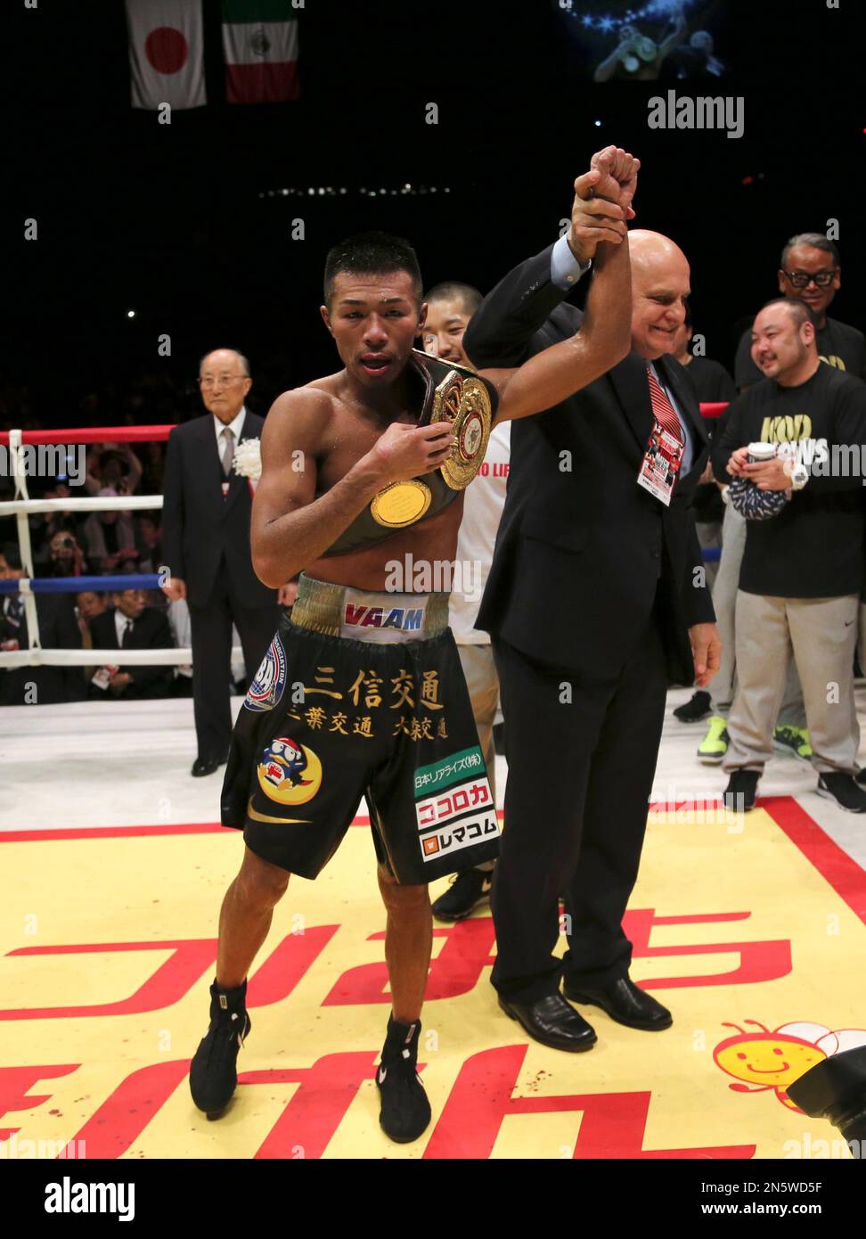 Japanese champion Takashi Uchiyama wearing his belt is celebrated after ...