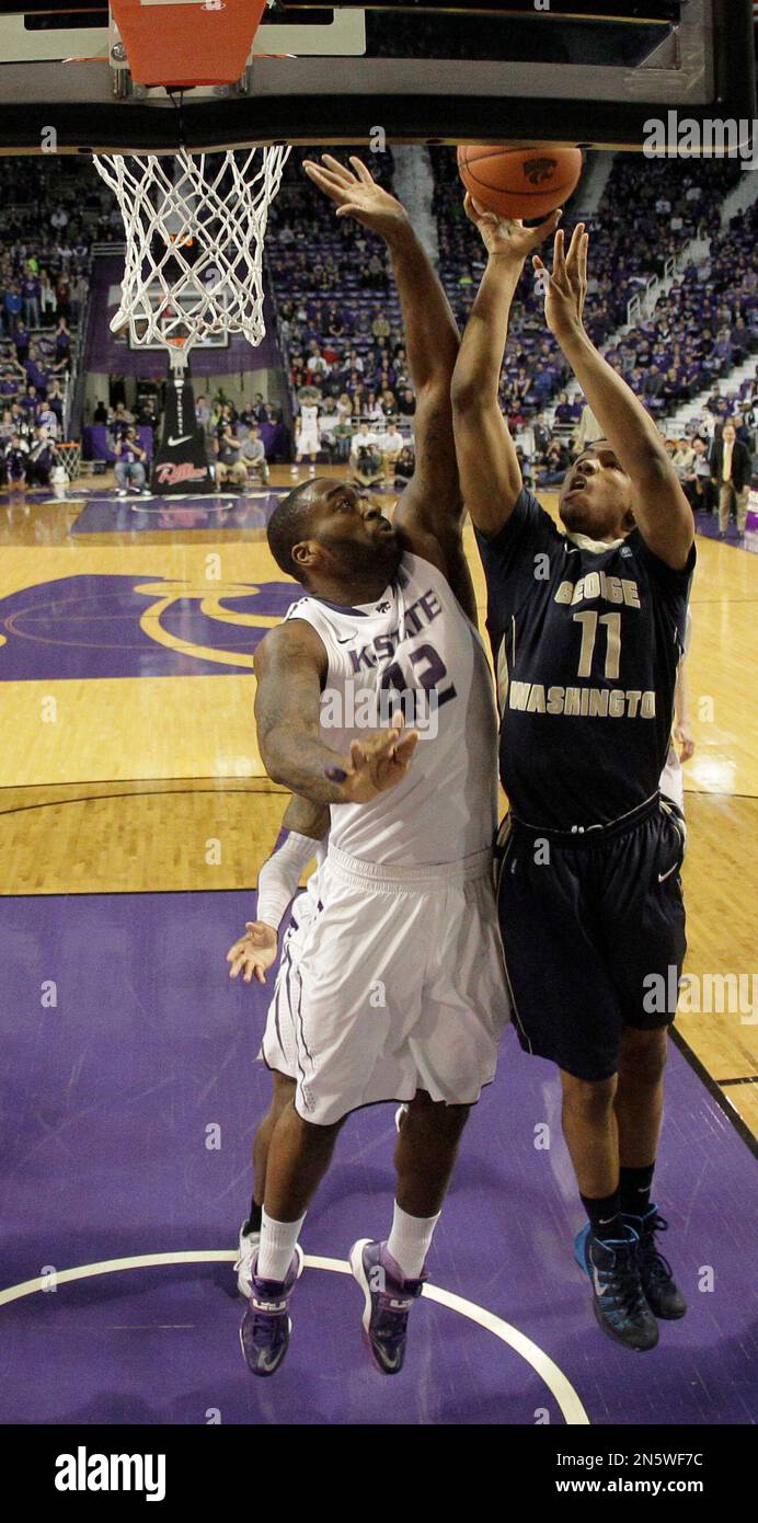 George Washington's Kethan Savage (11) shoots under pressure from ...