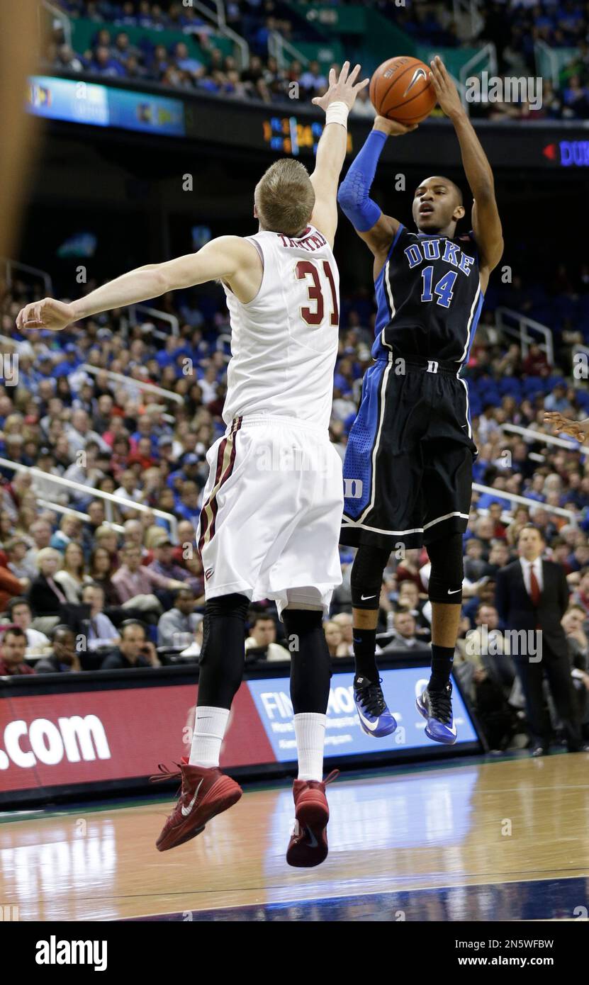 Duke's Rasheed Sulaimon (14) shoots over Elon's Lucas Troutman (31 ...