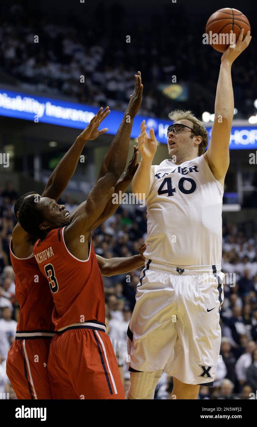 Xavier center Matt Stainbrook (40) shoots over St. John's forward God ...