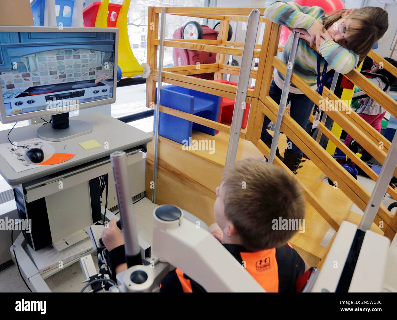 In this Dec. 16, 2013, photo, Jordyn Cunningham watches her 11-year-old ...