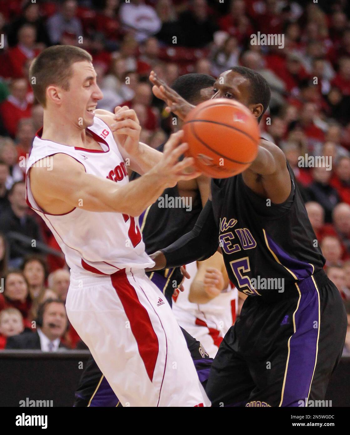 Wisconsin's Josh Gasser, left, passes against Prairie View's Tre Hagood ...