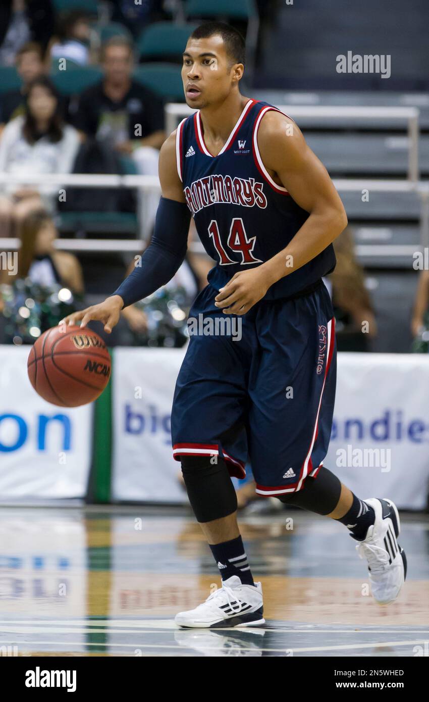 St. Mary's guard Stephen Holt (14) dribbles the basketball up court in ...