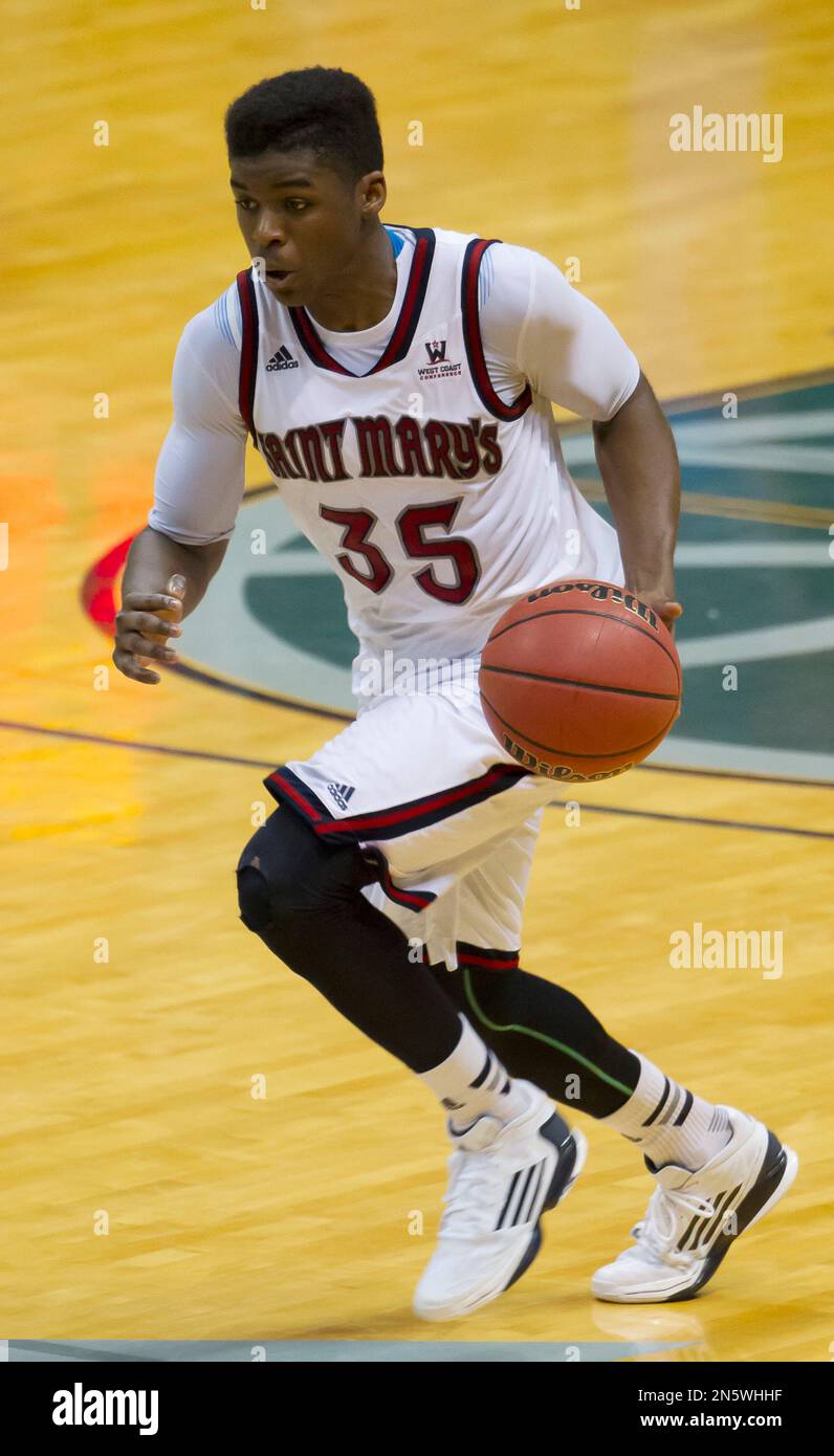 St. Mary's guard James Walker III (35) dribbles the basketball up court in the second half of an ...