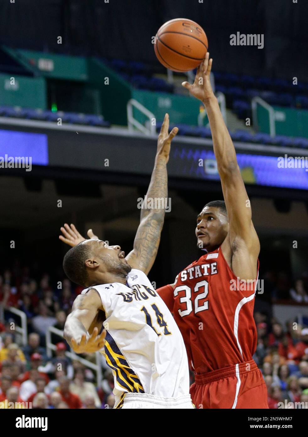North Carolina State's Kyle Washington (32) shoots over UNC-Greensboro ...