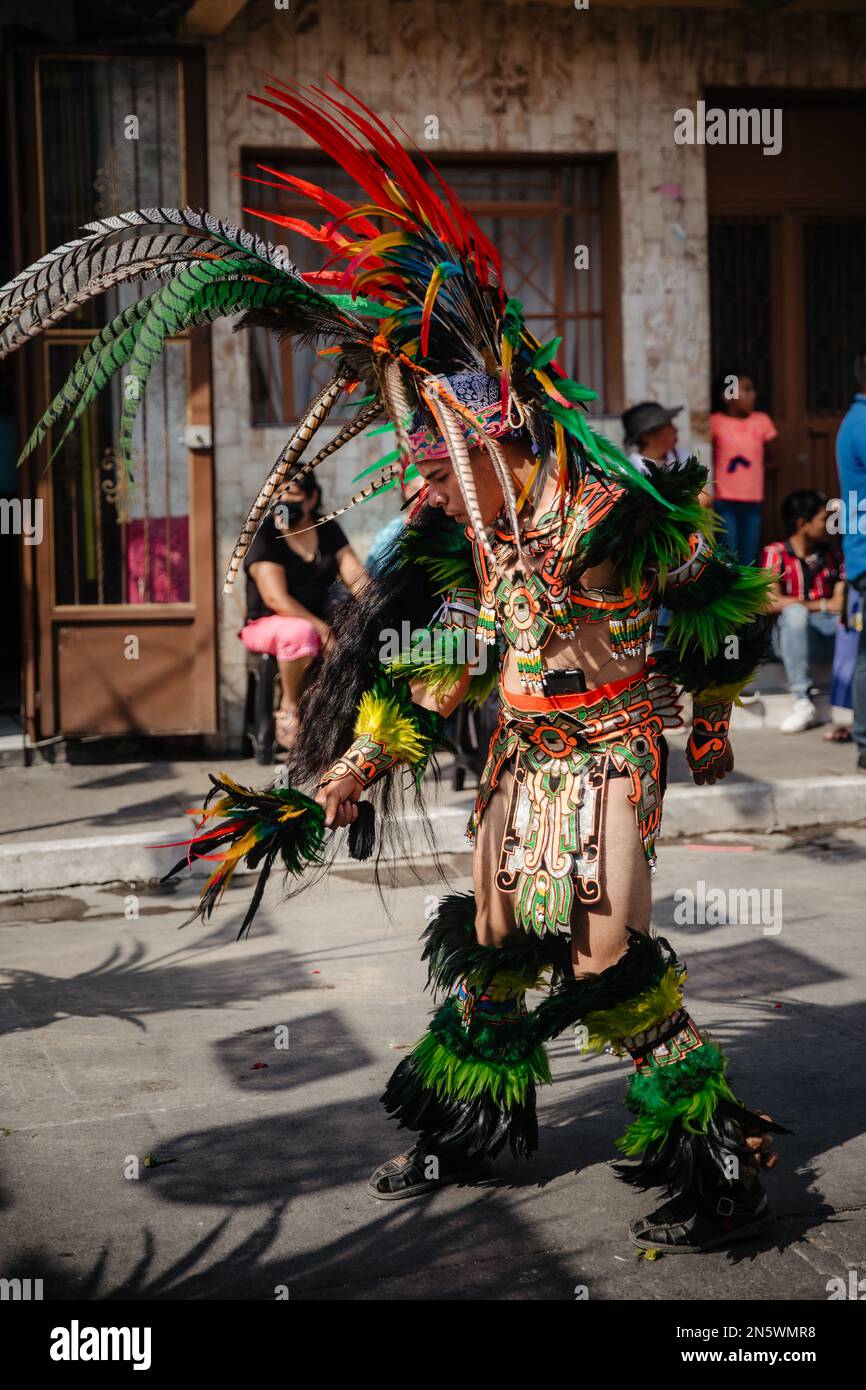A young man in a colorful costume during the annual dancing parade for ...