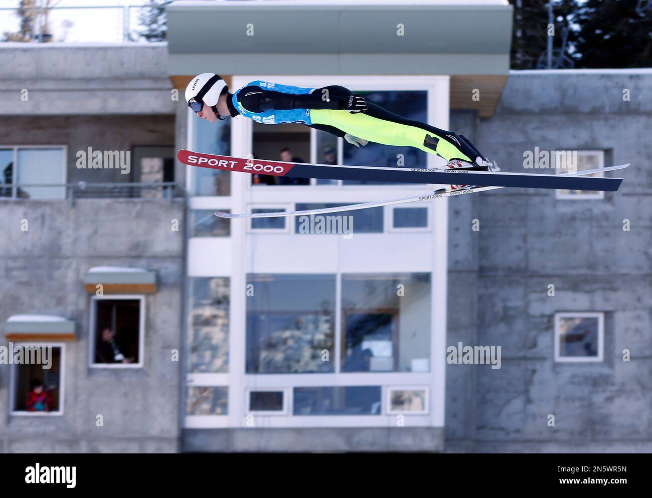 First-place finisher Nicholas Fairall competes in the men's ski jumping ...