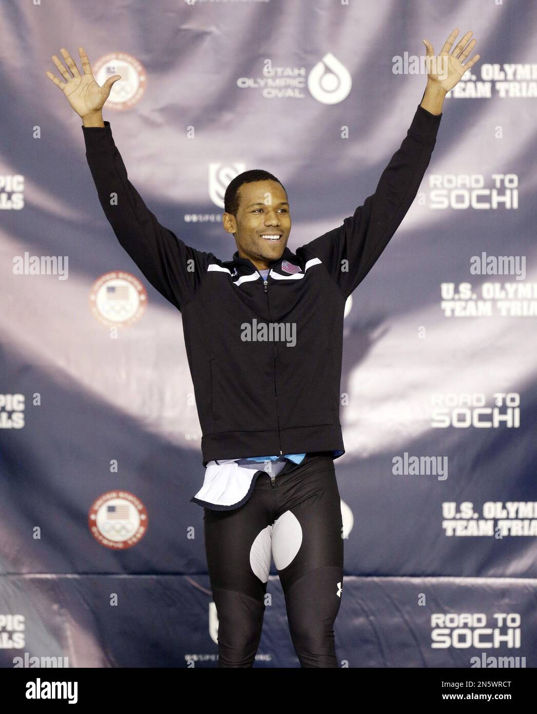 First-place finisher Shani Davis celebrates on the podium following the ...