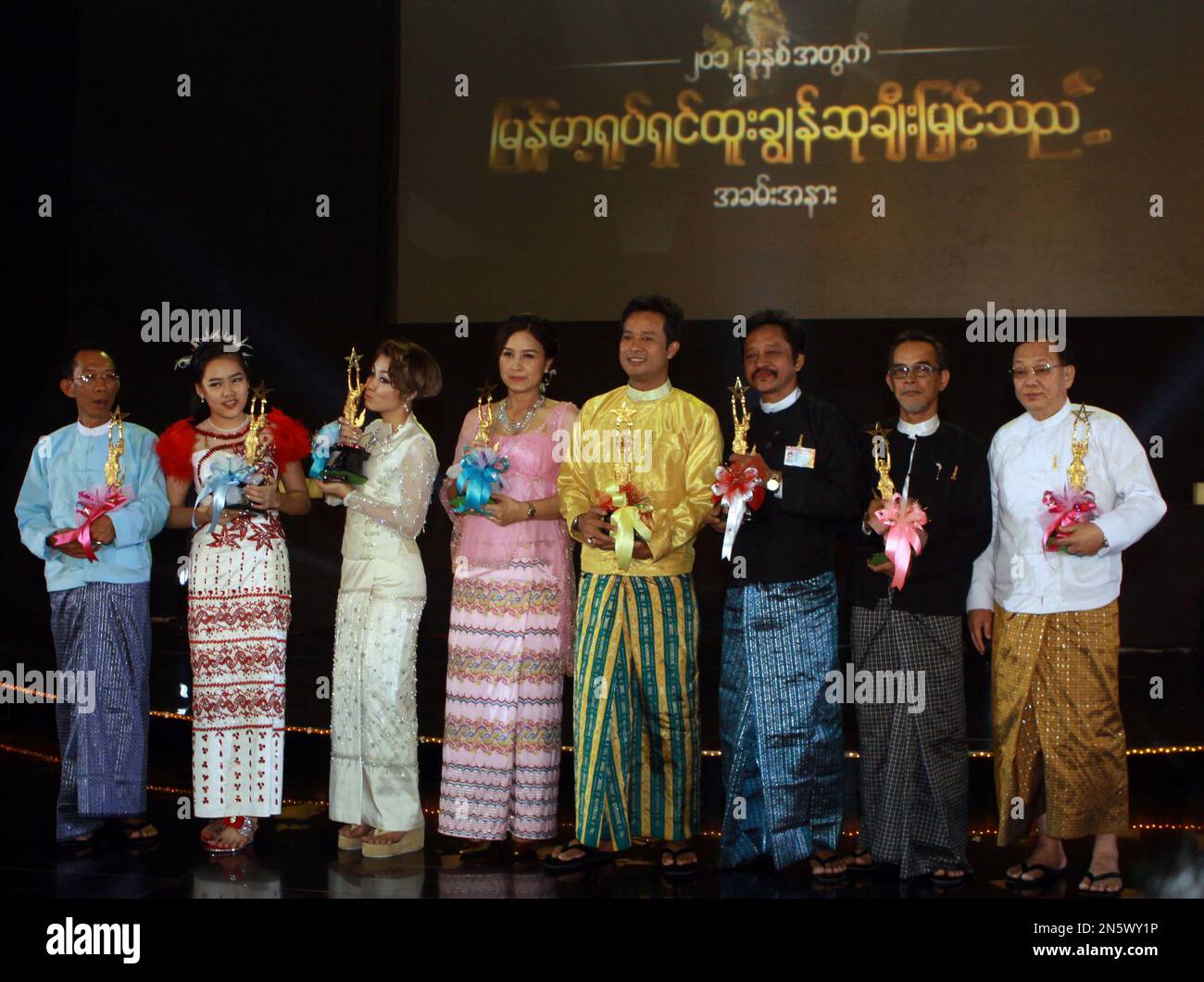 Winners of Myanmar Academy awards pose for photos with their trophies, during Myanmar Academy ...
