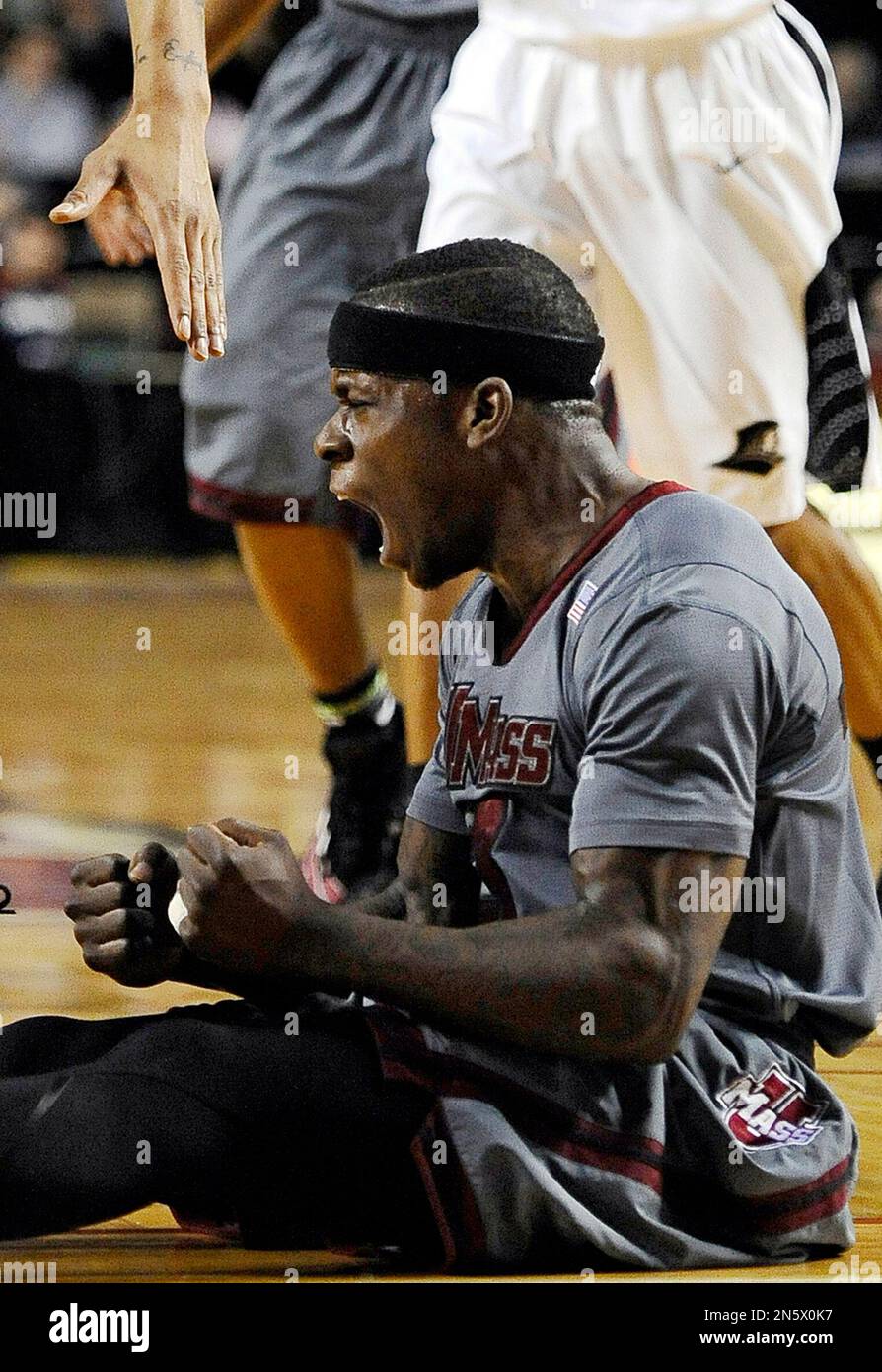 Massachusetts' Chaz Williams reacts as teammate Maxie Esho reaches out ...