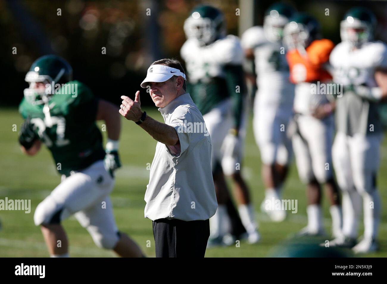 Michigan State head coach Mark Dantonio signals to his players during ...