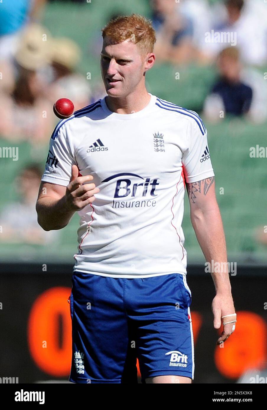 England's Ben Stokes flips a ball during a warm up before playing ...
