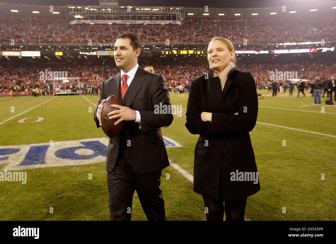 San Francisco 49ers owner Jed York and his wife Danielle walk off the ...