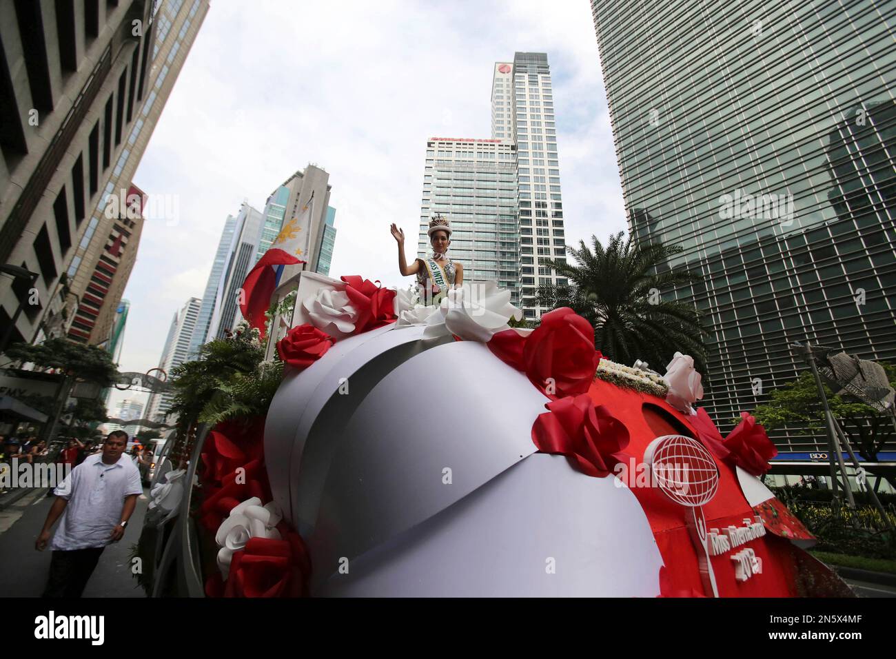 Miss International 2013 Bea Santiago waves from her float during a ...