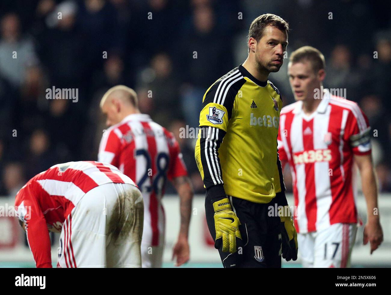 Stoke City's goalkeeper Thomas Sorenson stands dejected after being ...