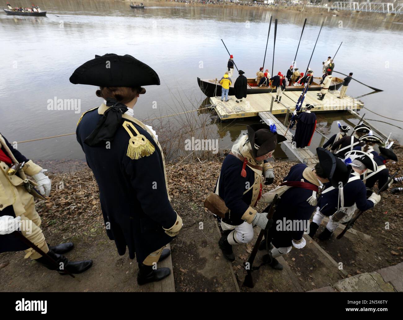 John Godzieba, left, playing the role of Gen. George Washington, walks ...