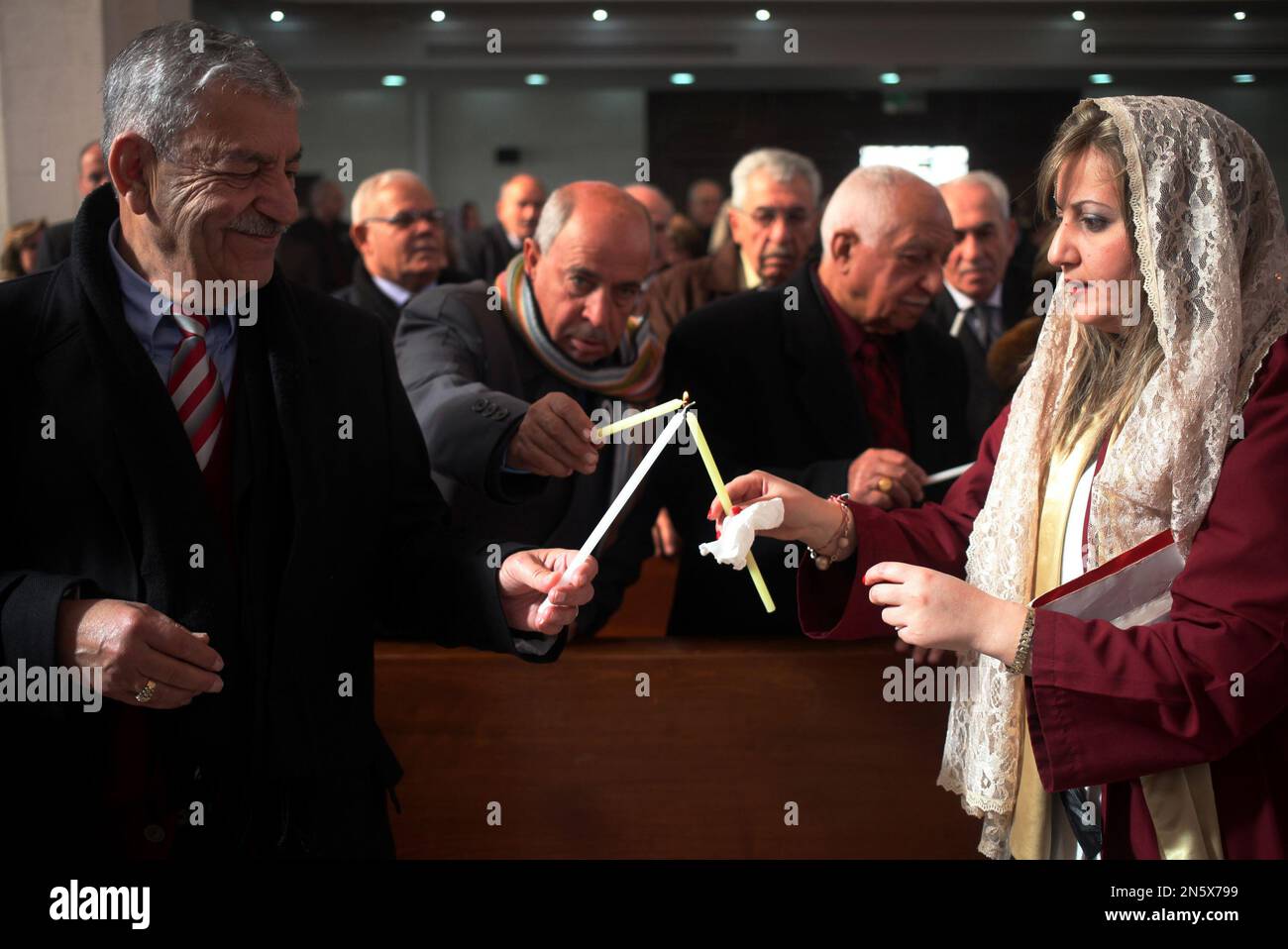 Syrian and Iraqi Orthodox Christian refugee families attend morning ...