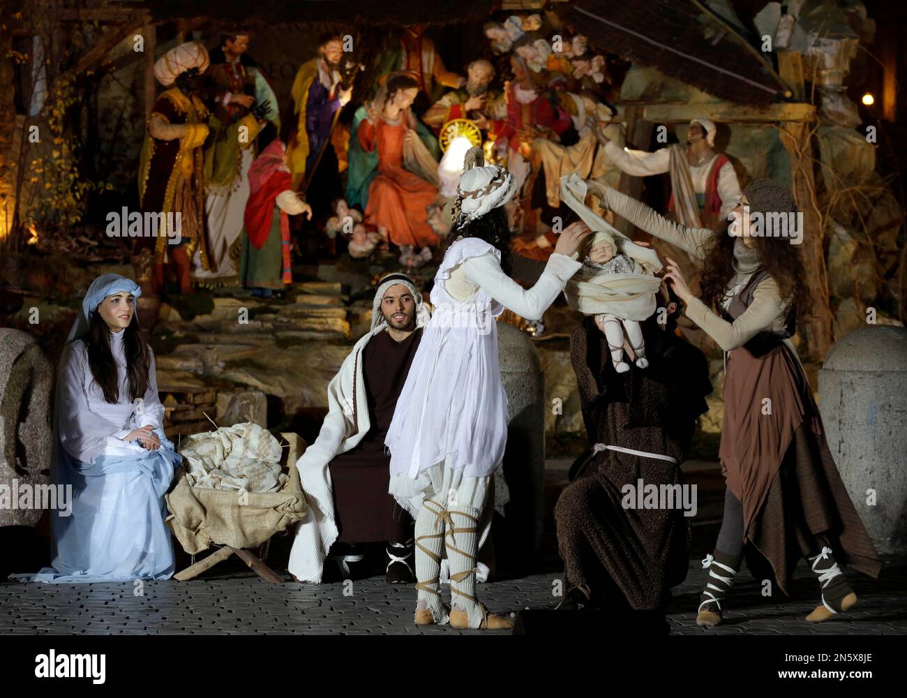 Dancers impersonating Mary, Joseph and St. Francis perform in front of ...