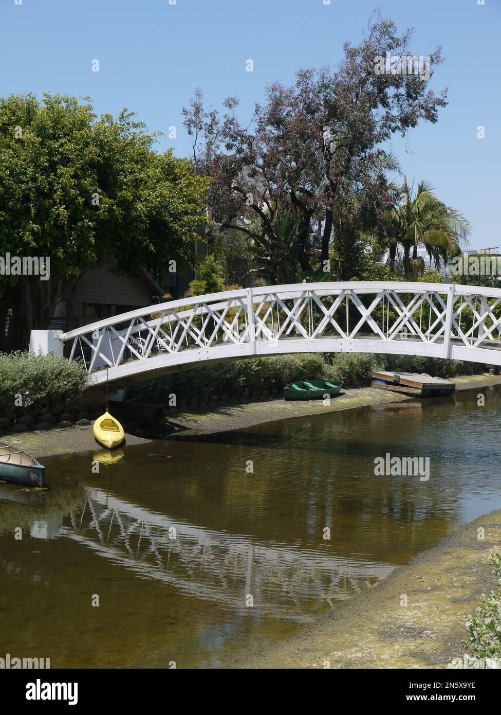 Arched pedestrian bridge over a canal in Venice Canal Historic District ...