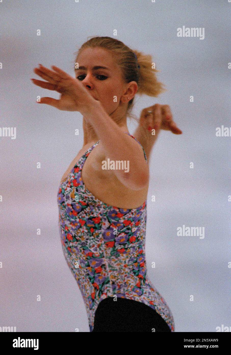 Figure skater Tonya Harding displays a ringless left hand during her ...
