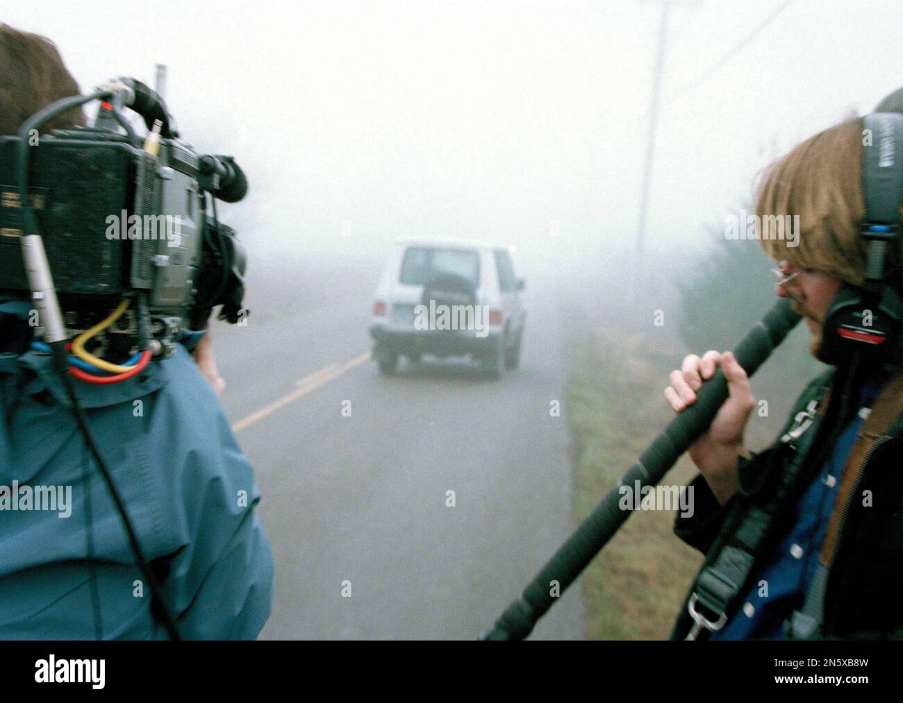 Figure skater Tonya Harding and her ex-husband Jeff Gillooly drive away ...
