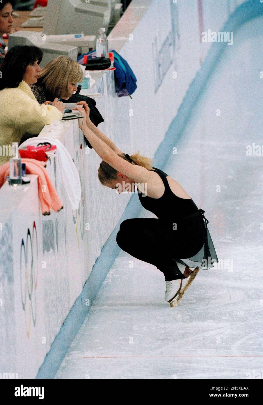 Coach Diane Rawlinson talks to American figure skater Tonya Harding as ...
