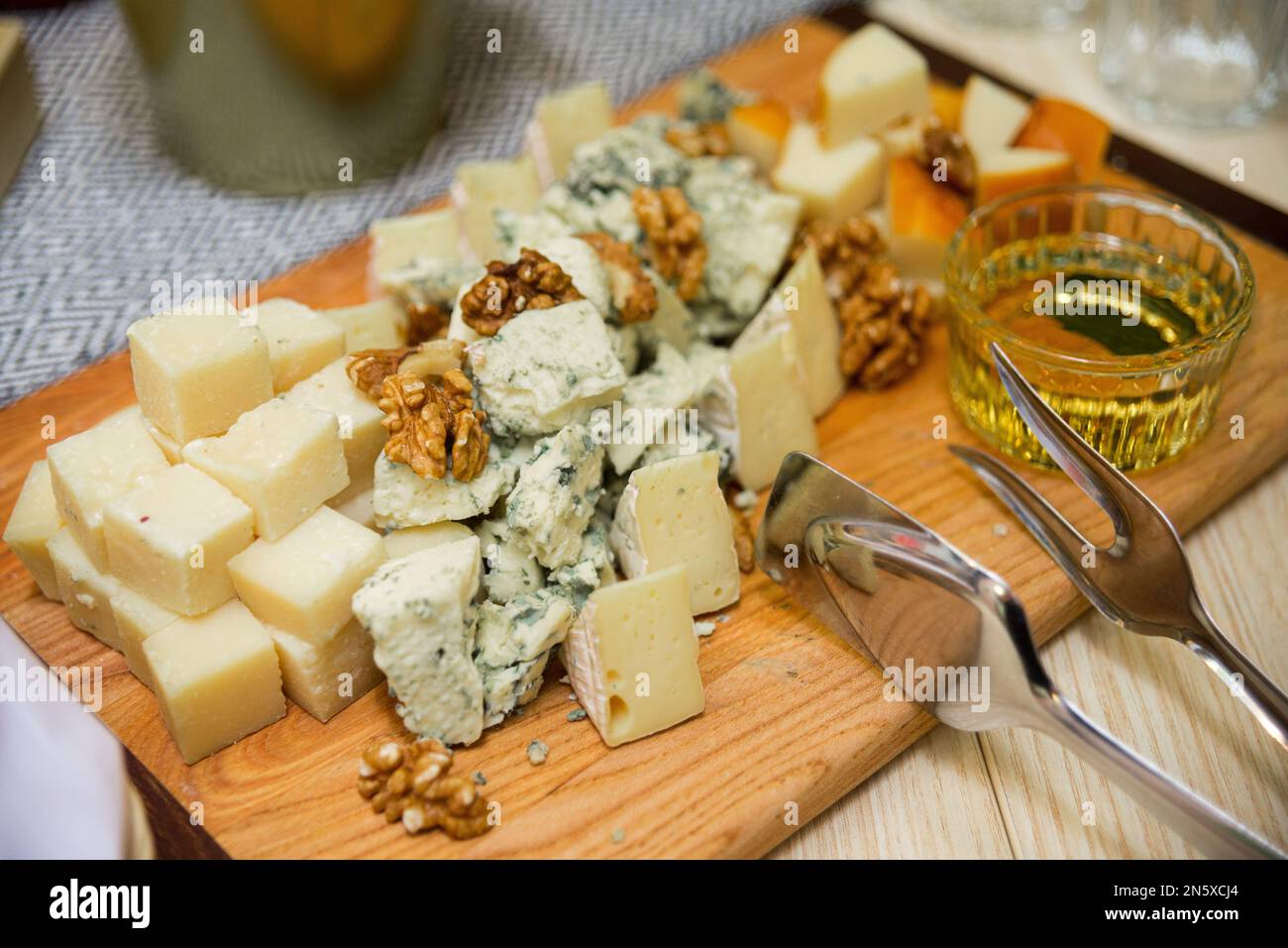 Cheese platter with different types of cheese, walnuts and honey Stock ...