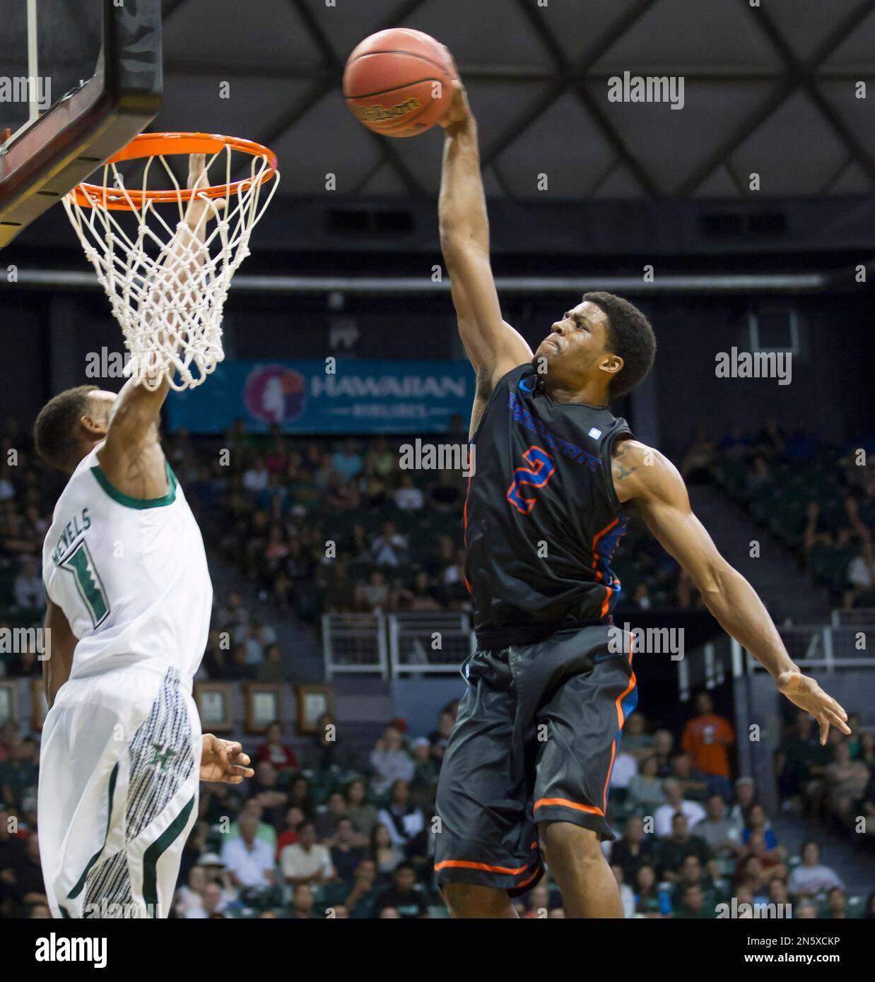Boise State guard Derrick Marks (2) dunks the basketball on Hawaii ...