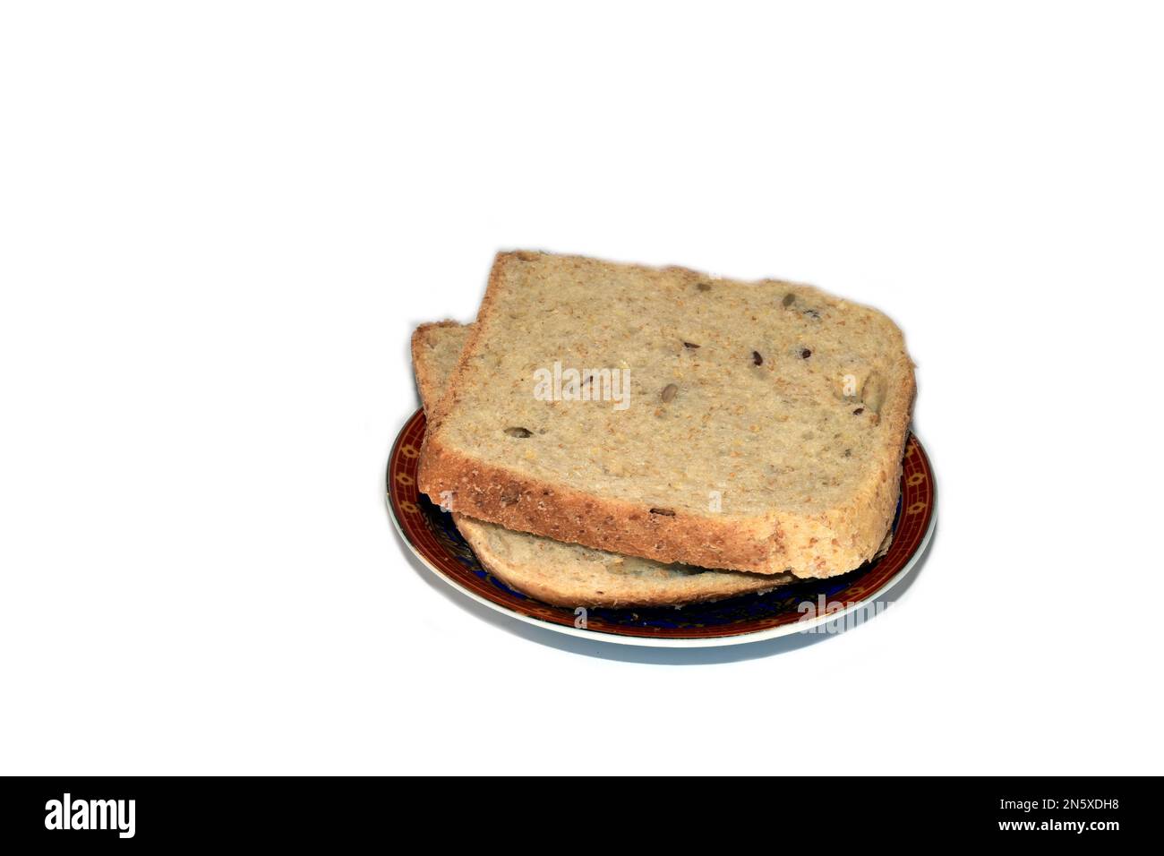 Toast bread on a small plate isolated on a white background Stock Photo ...
