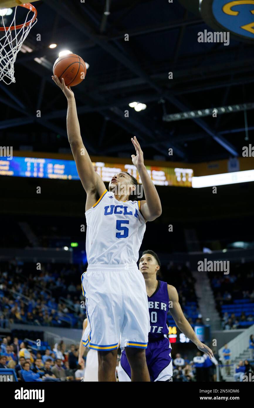 UCLA's Kyle Anderson shoots in front of Weber State's Jeremy Senglin ...