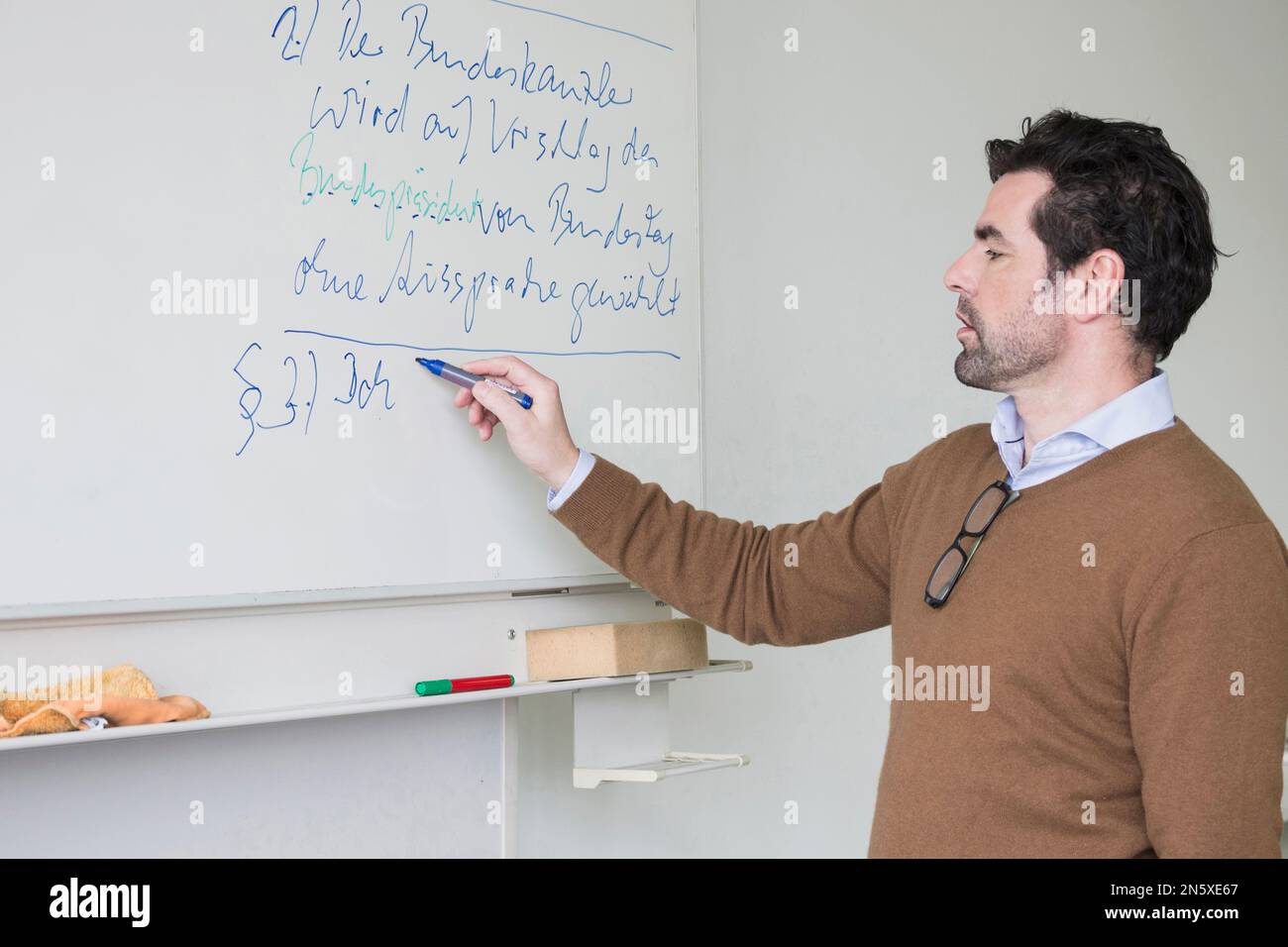 Teacher explaining on white board School, Bavaria, Germany Stock Photo ...